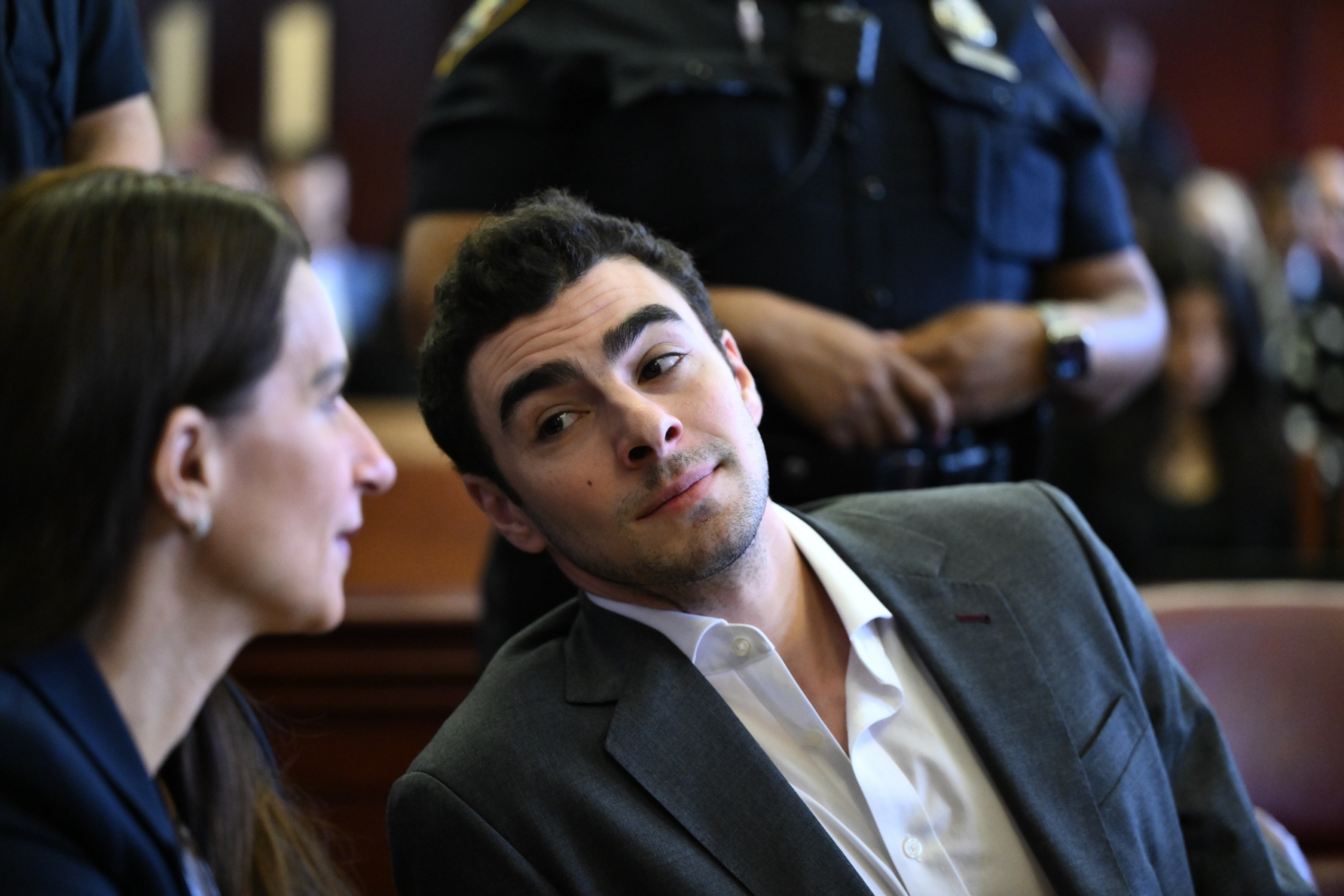 Video shows Luigi Mangione says he didn’t want to talk. Police kept asking questions | WBHM 90.3