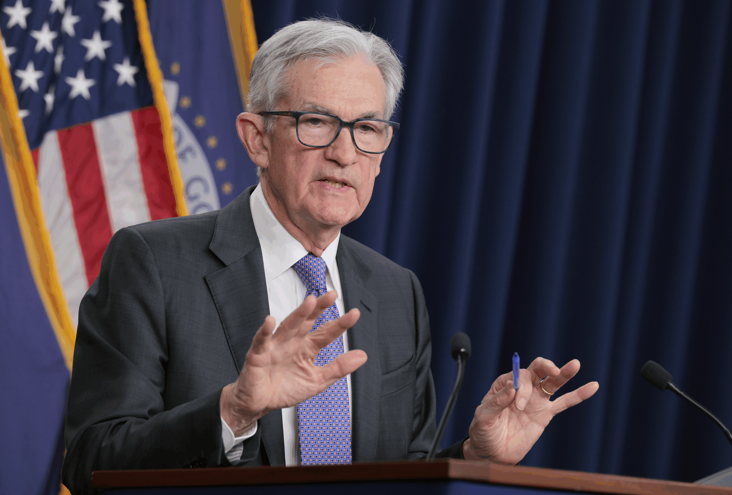 Fed holds interest rates steady, taking a pause from rate cuts to ...